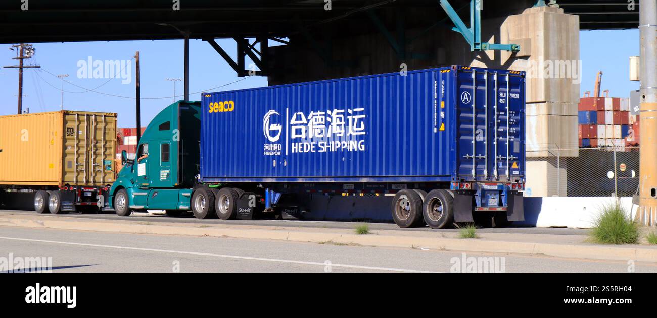 Freight Truck carrying an HEDE SHIPPING shipping container on a street ...