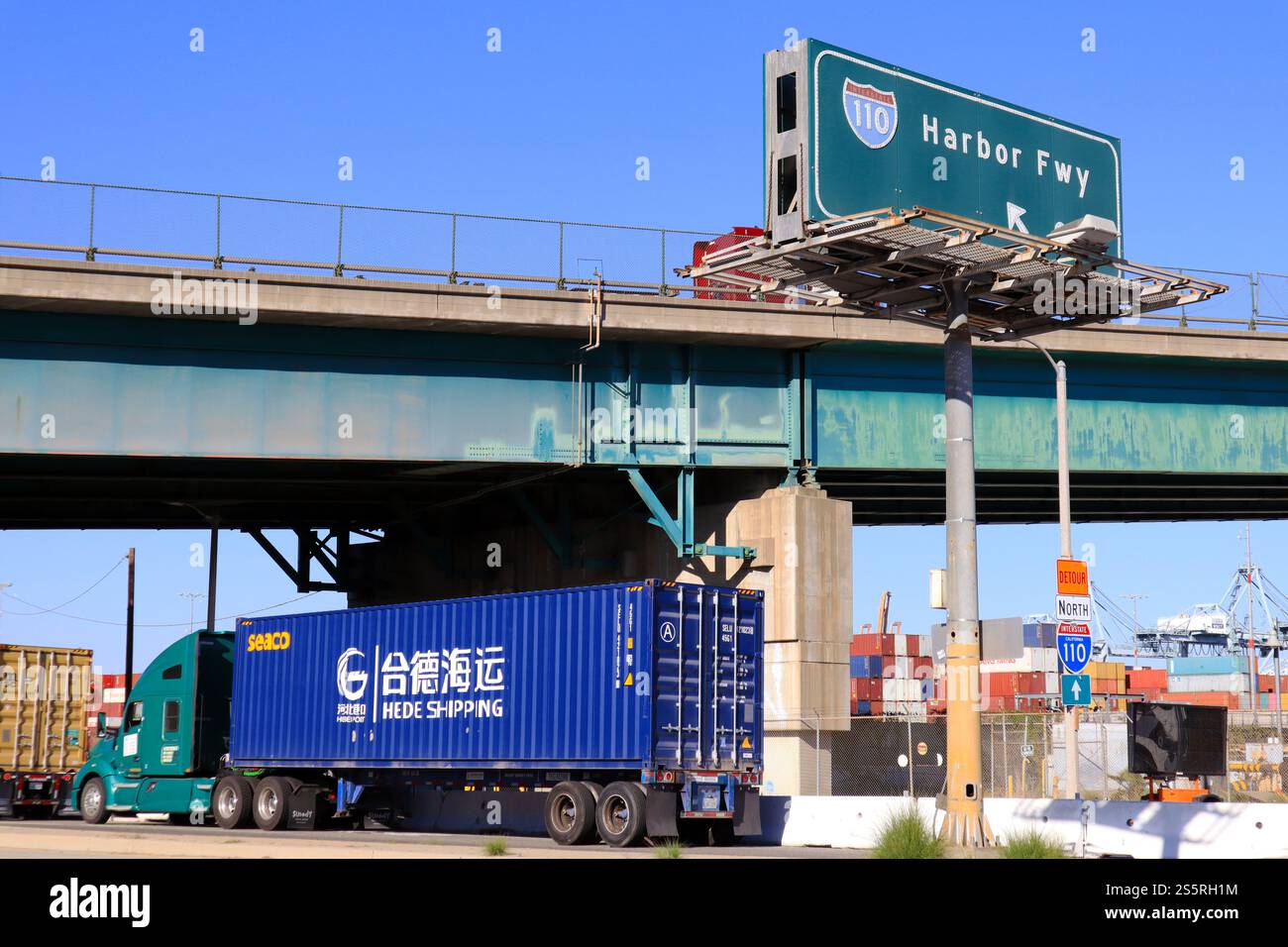 Freight Truck carrying an HEDE SHIPPING shipping container on a street ...
