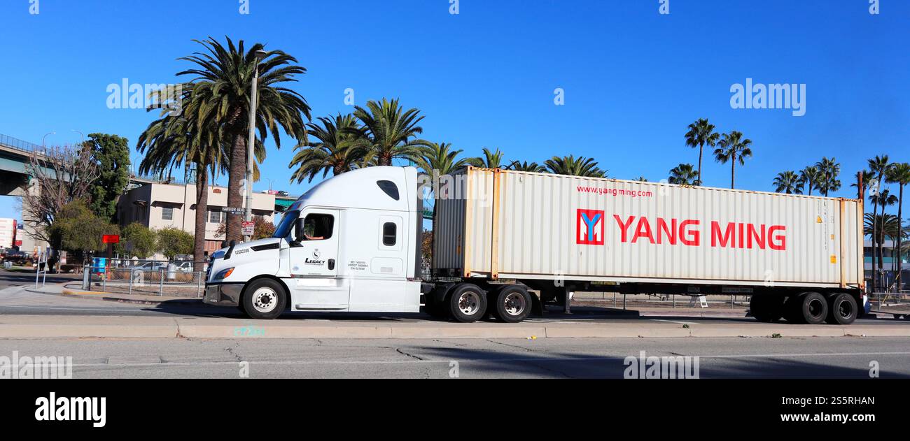 Freight Truck carrying a YANG MING shipping container on a street ...
