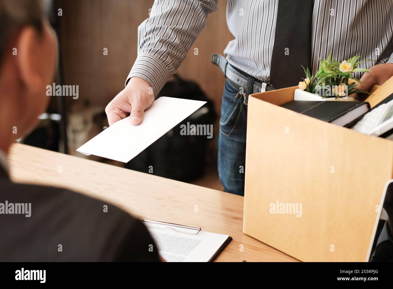 Business man sending resignation letter to boss and Holding Stuff ...