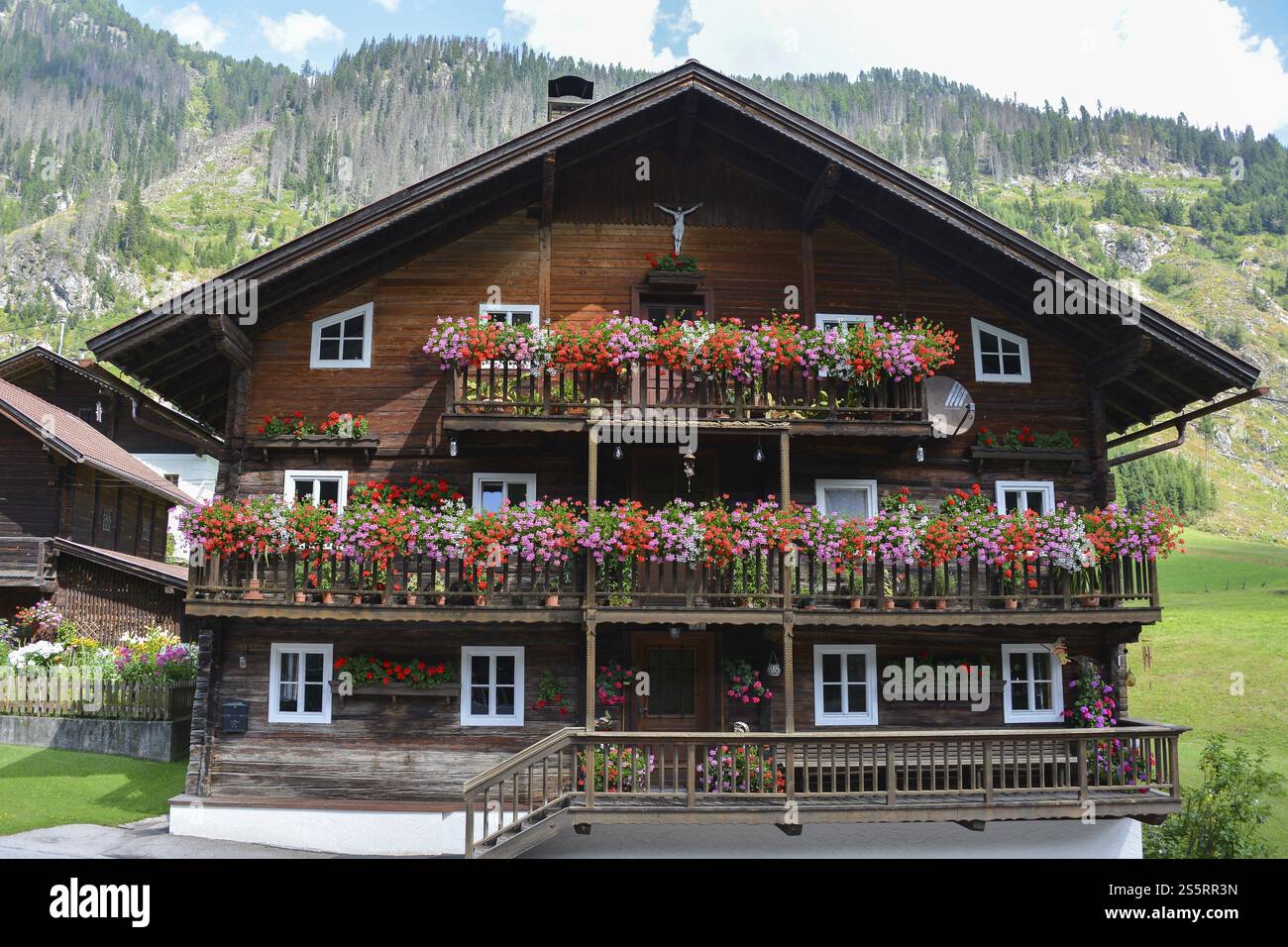 Typical traditional farmhouse, a solid wooden house, with balcony ...