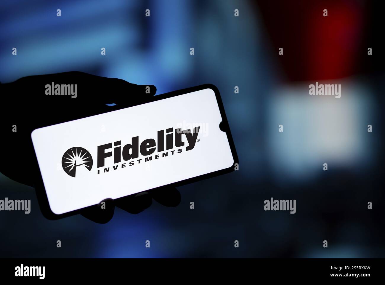 Fidelity investments logo is displayed on smartphone. Fidelity ...