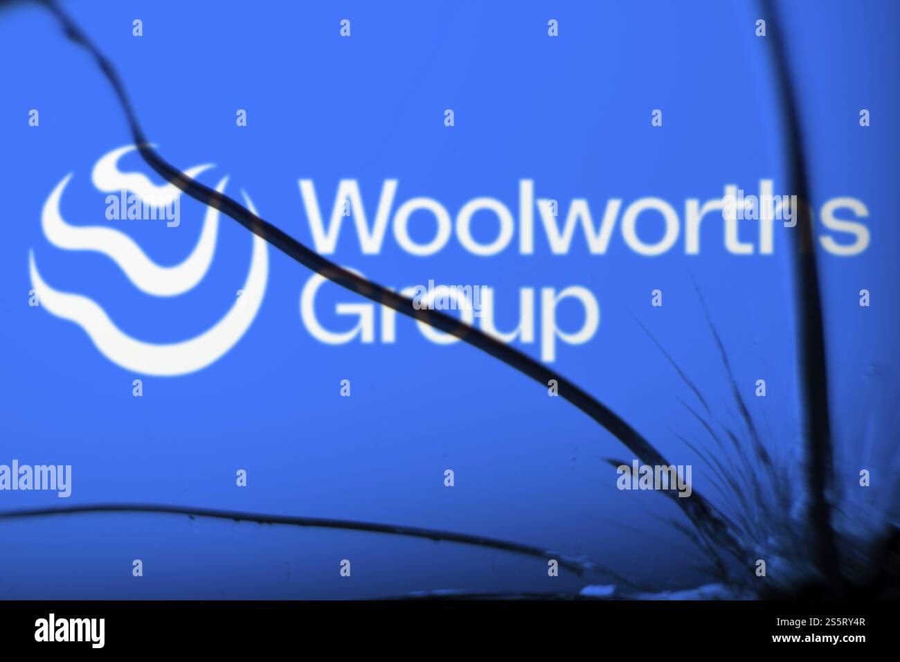 Woolworths group logo is visible on the broken glass. Woolworths Group ...