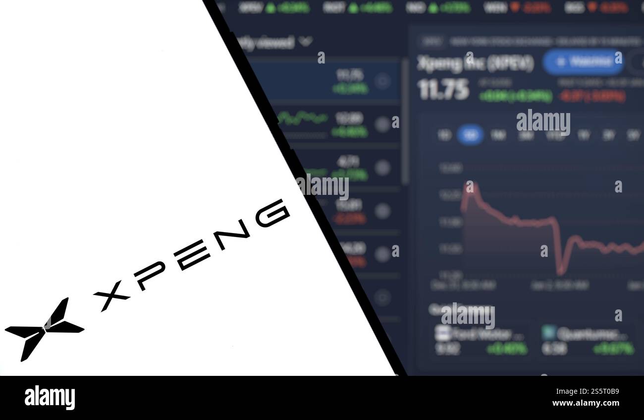 Xpeng logo is displayed on smartphone. Guangzhou Xiaopeng Motors ...