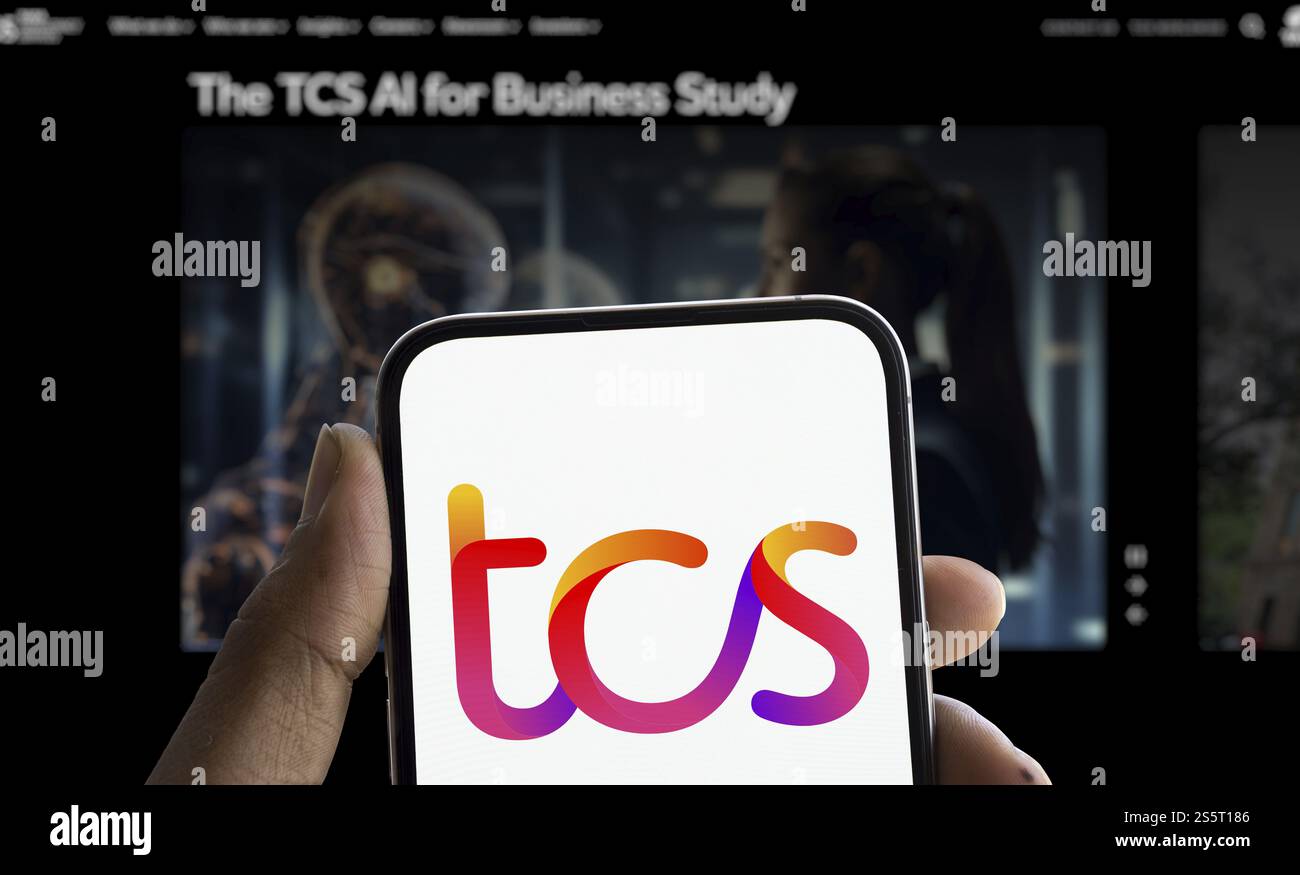 Tcs logo is displayed on smartphone. Tata Consultancy Services (TCS) is ...
