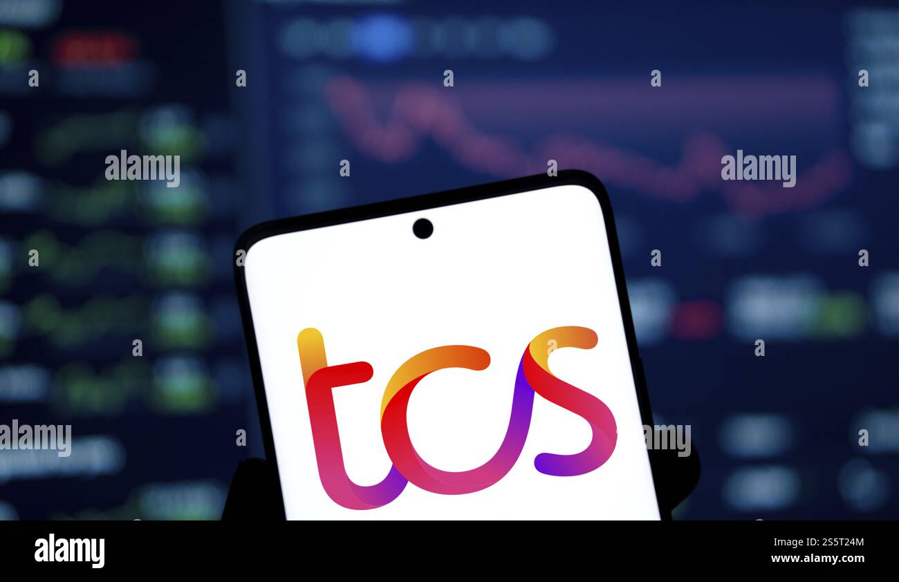 Tcs logo is displayed on smartphone. Tata Consultancy Services (TCS) is ...