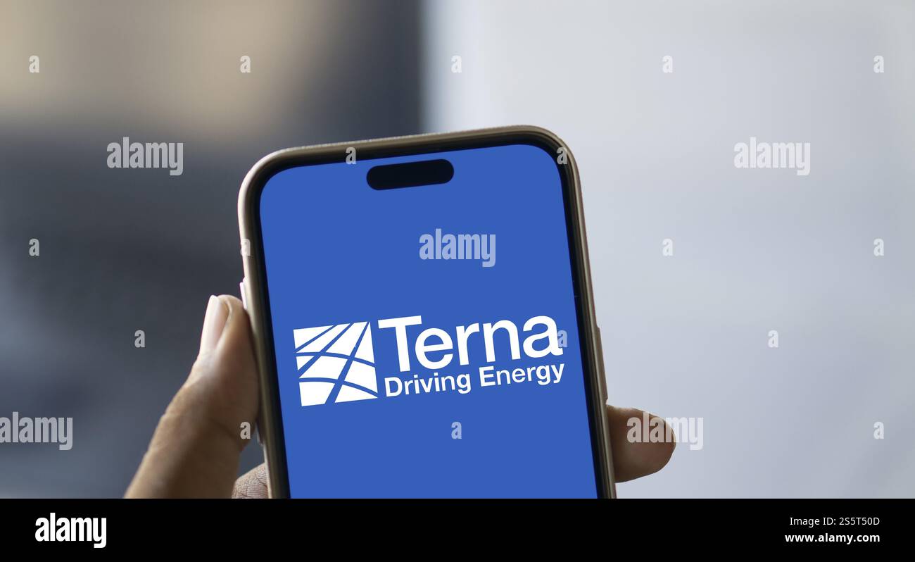 Terna driving energy logo is displayed on smartphone. Terna S.p.A. is a ...