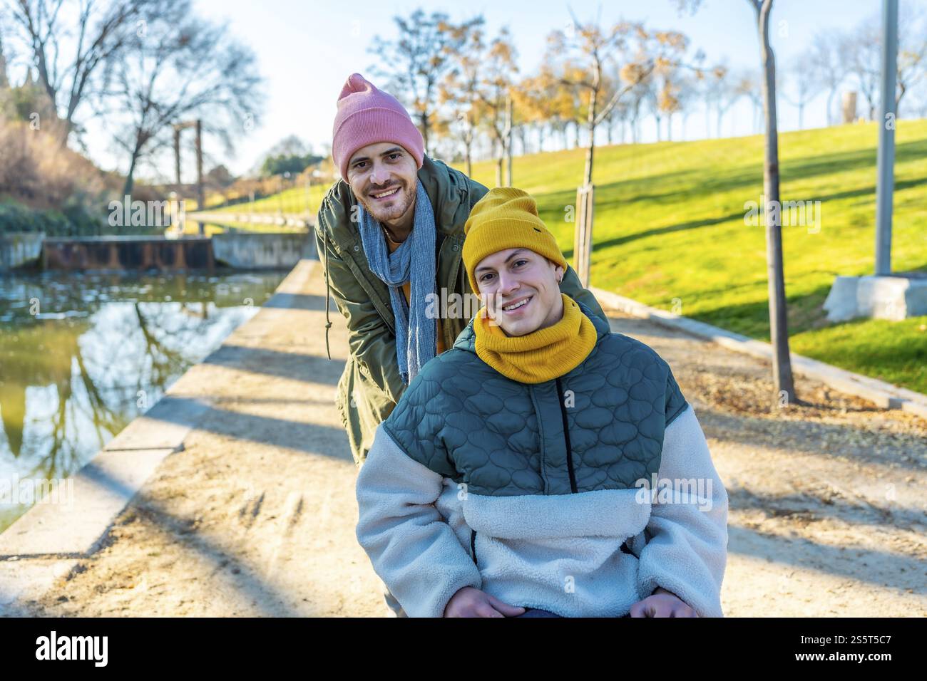Two friends enjoying a sunny day in the park, demonstrating inclusion ...