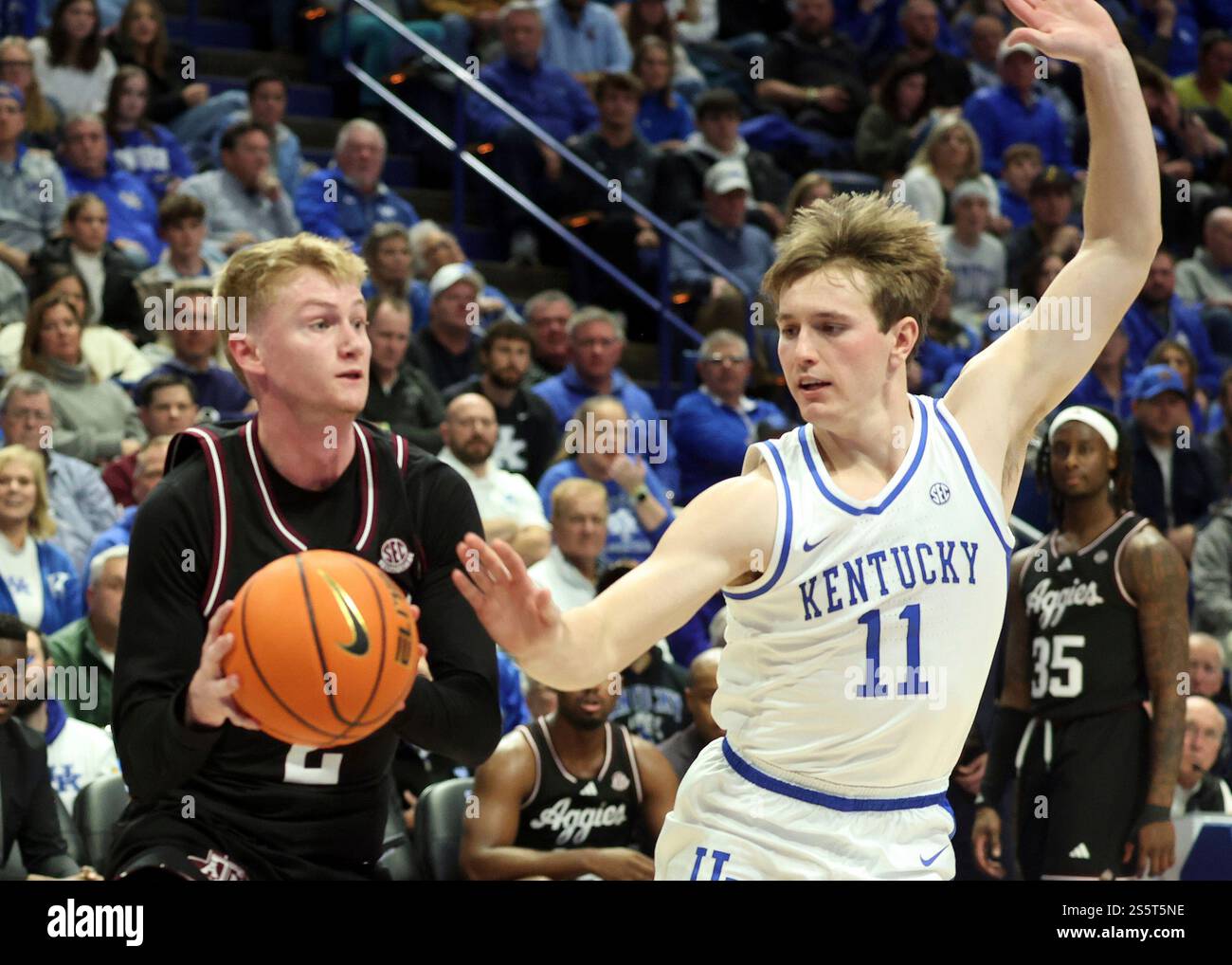Texas A&M's Hayden Hefner, left, is pressured by Kentucky's Travis ...