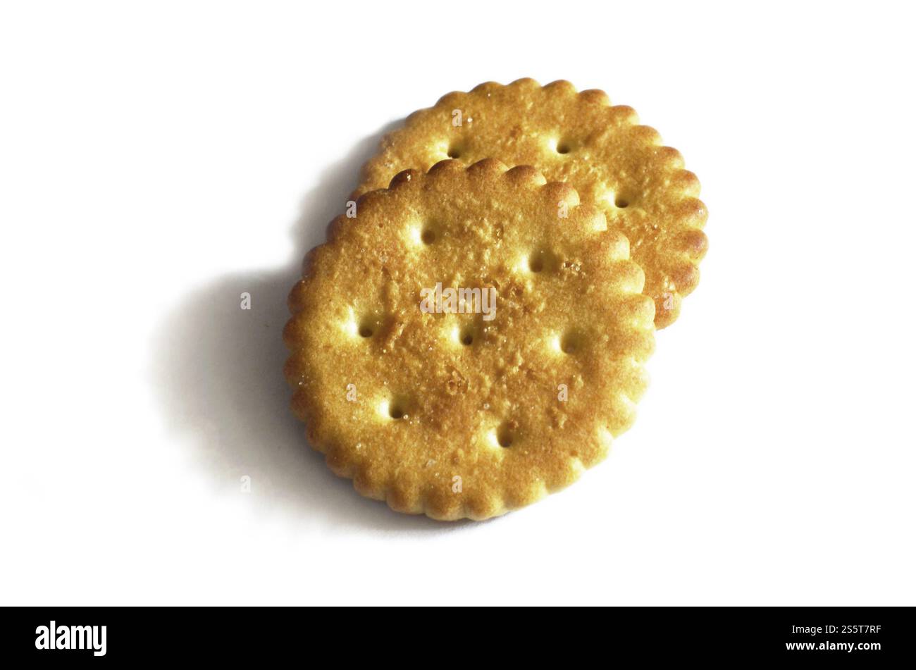 Classic round golden yellow salted cracker isolated on over white ...