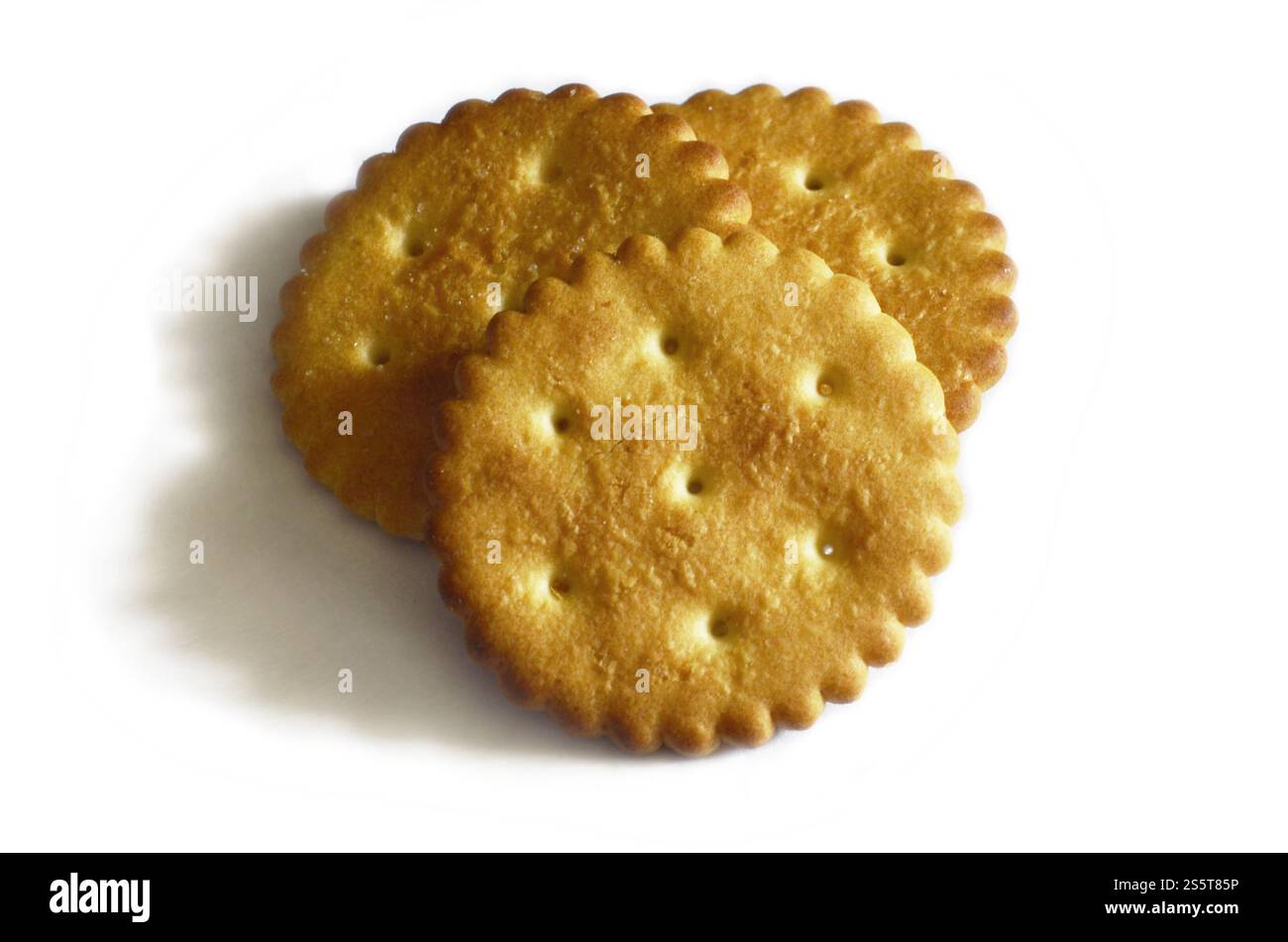 Classic round golden yellow salted cracker isolated on over white ...