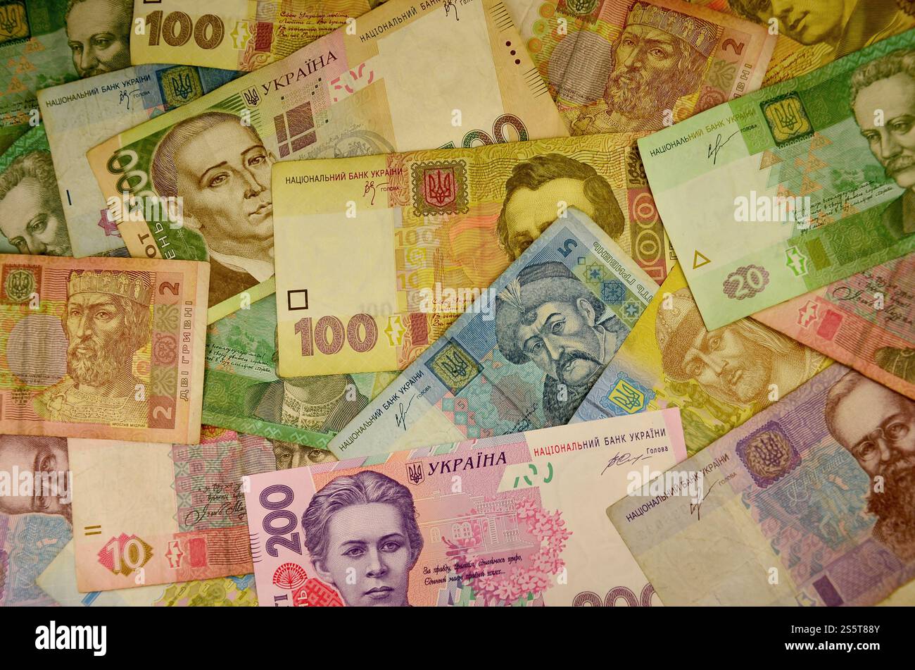 The background image of a pile of Ukrainian banknotes of different ...