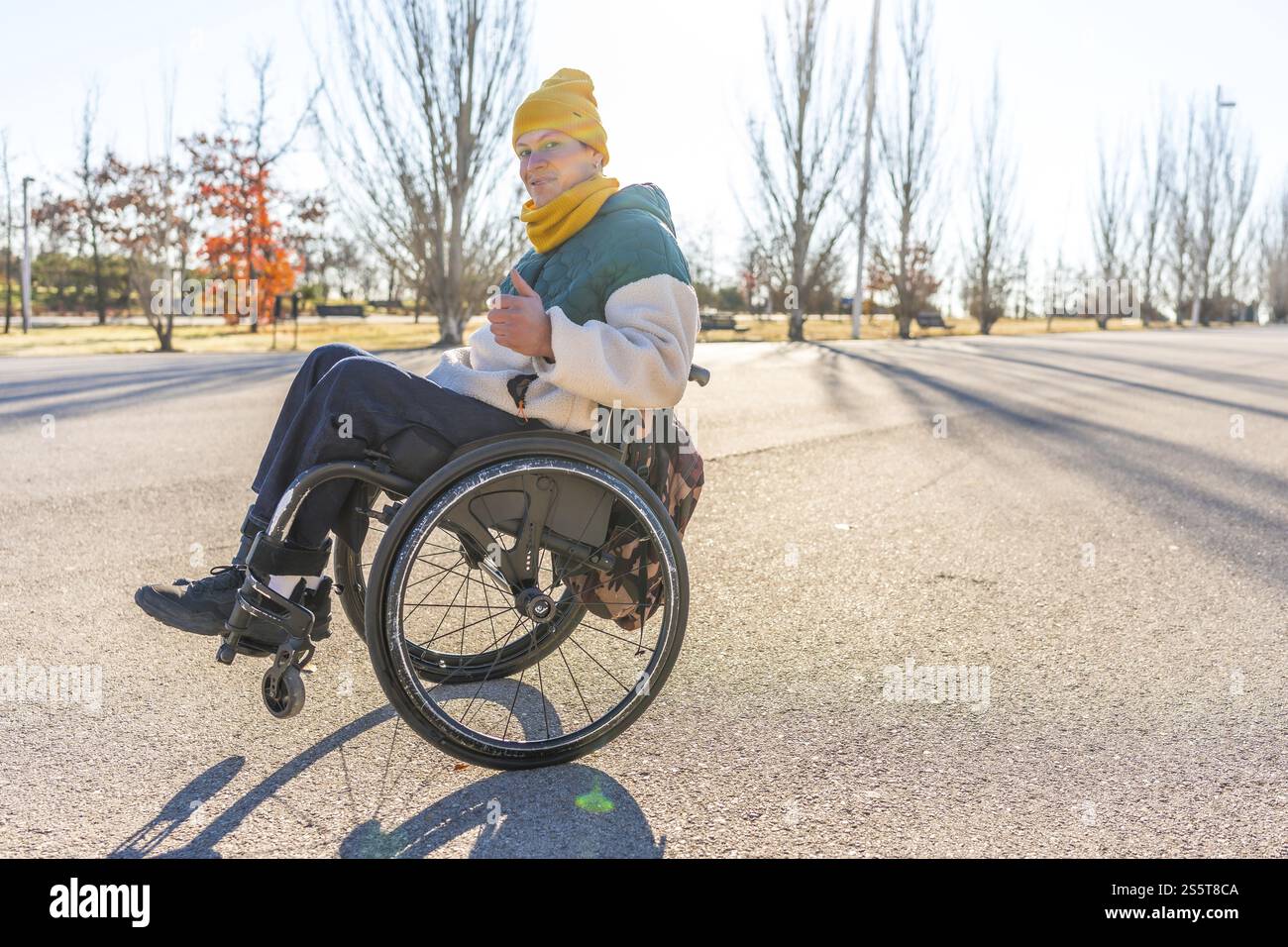 Person with a disability enjoying a sunny day in the park, showing ...