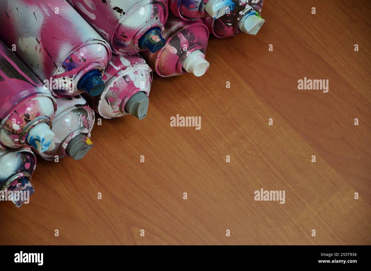 Still life with a large number of used colorful spray cans of aerosol ...