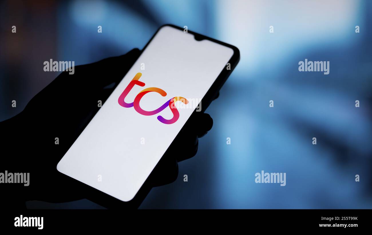 Tcs logo is displayed on smartphone. Tata Consultancy Services (TCS) is ...
