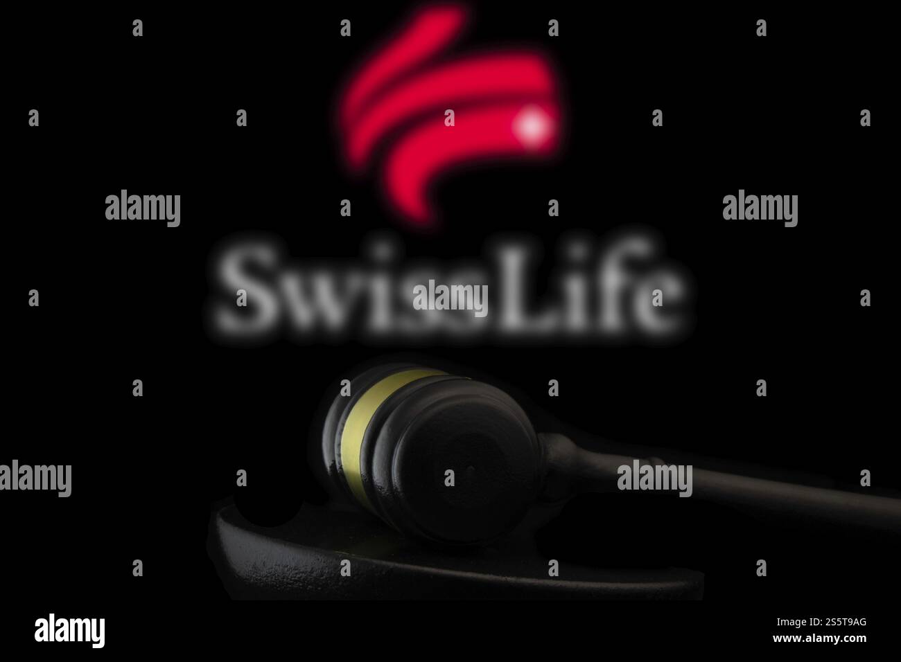 Court gavel in front of the Swiss life logo. Swiss Life Group is the ...
