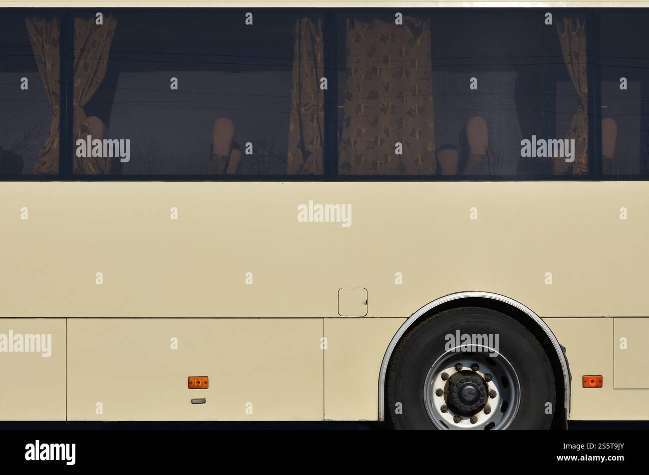 Photo of the hull of a large and long yellow bus with free space for ...