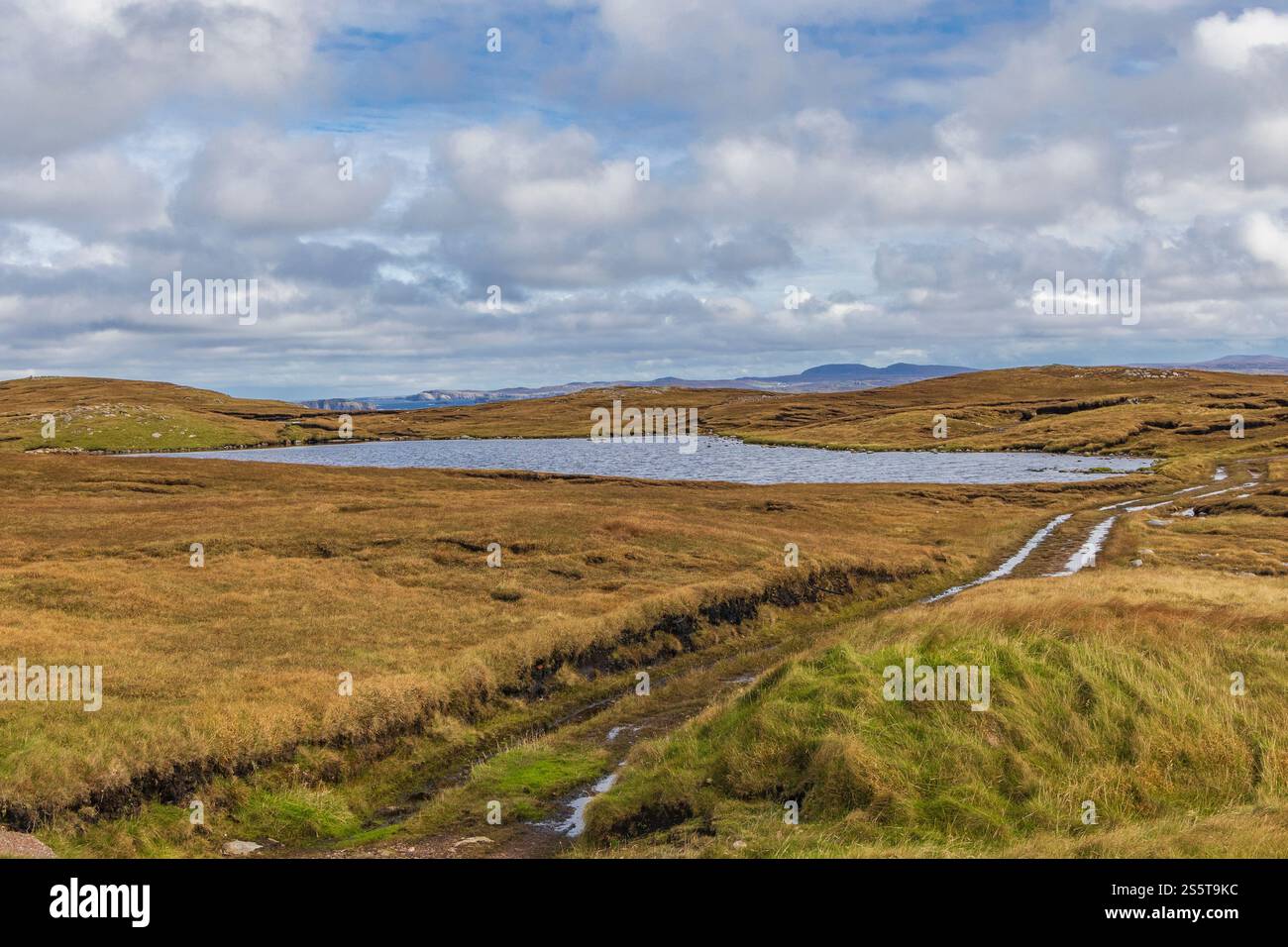 Scotland, Hebrides. Isle of Lewis, Aird Uig. Rutted dirt road to Loch a ...