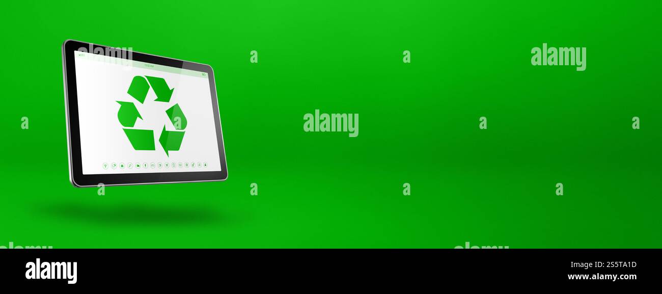Digital tablet PC with a recycling symbol on screen. environmental ...