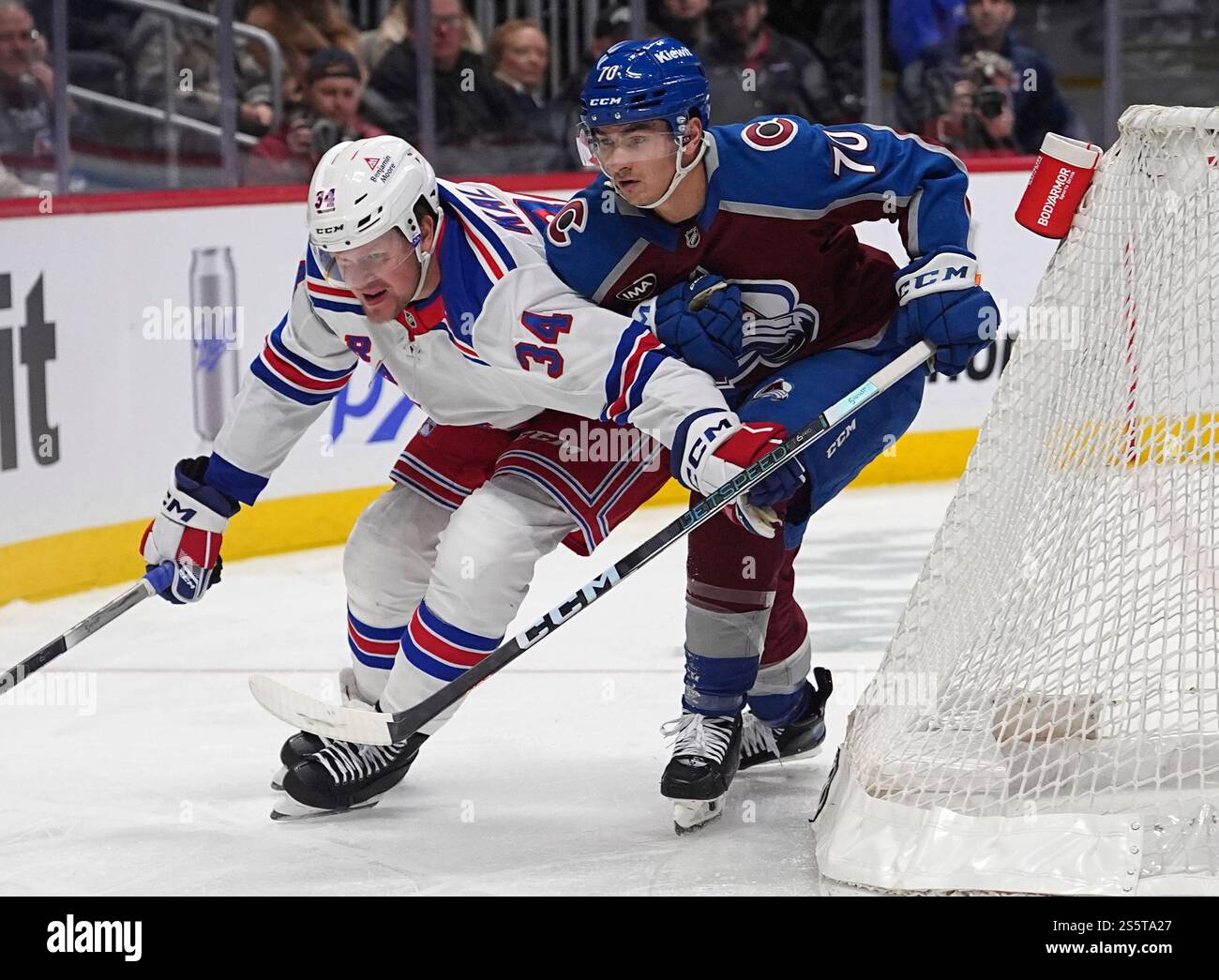 New York Rangers right wing Arthur Kaliyev, left, pursues the puck with ...