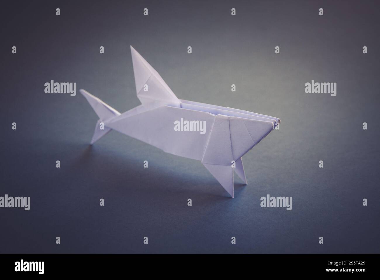 White paper shark origami isolated on a blank grey background. White ...