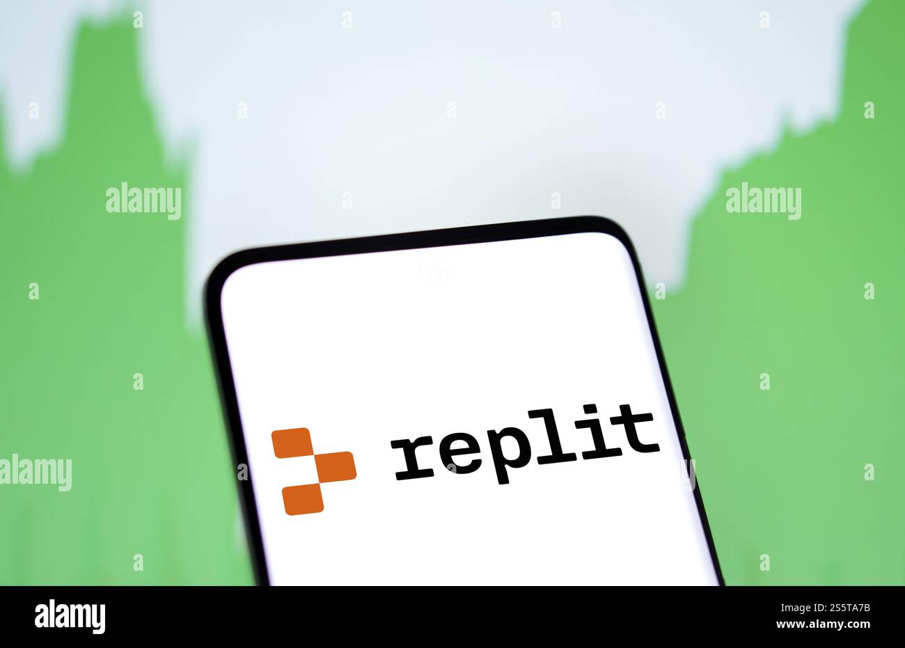 replit logo is displayed on smartphone. Replit is an American start-up ...