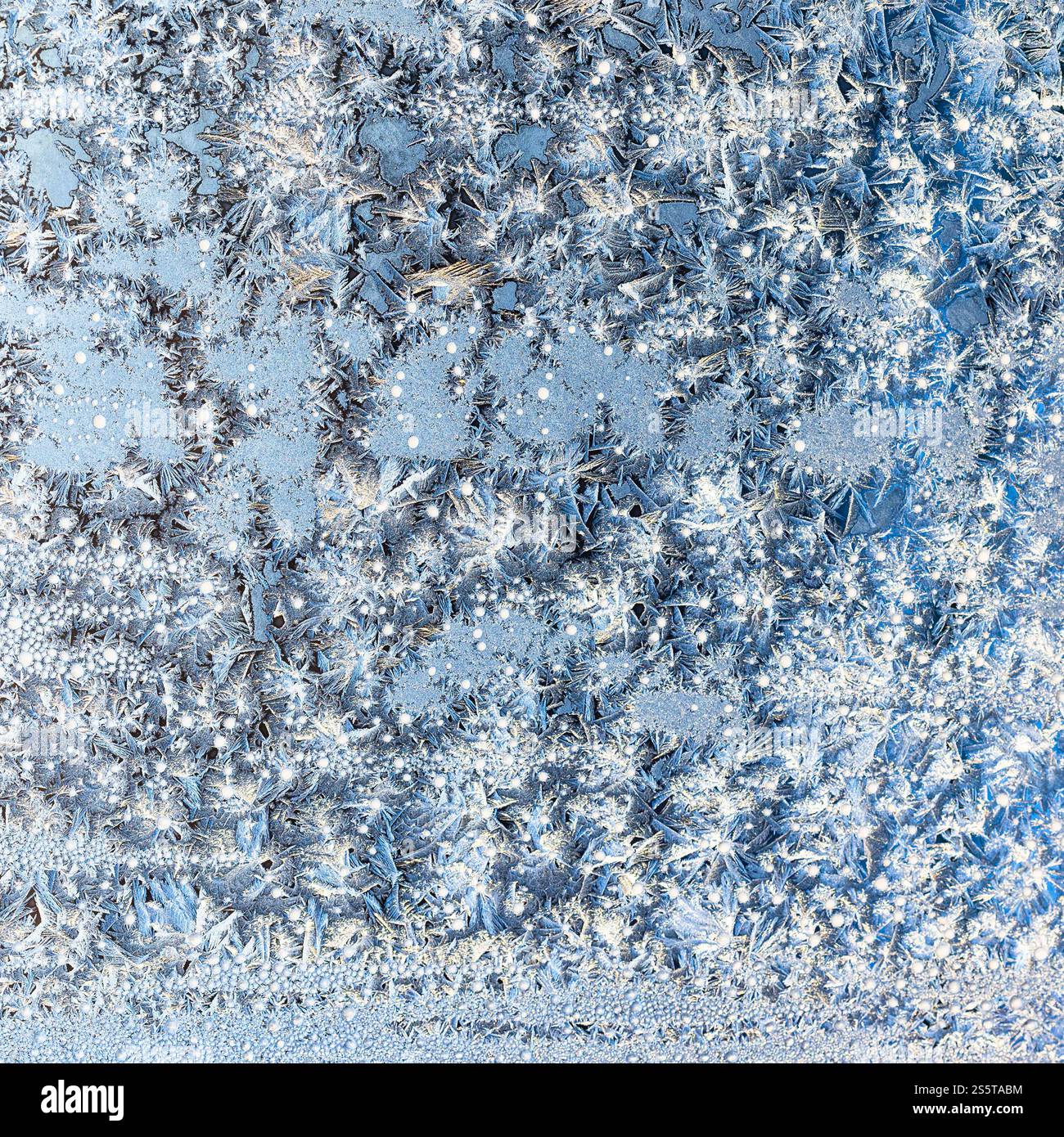 square natural background - frost on surface on home window glass ...