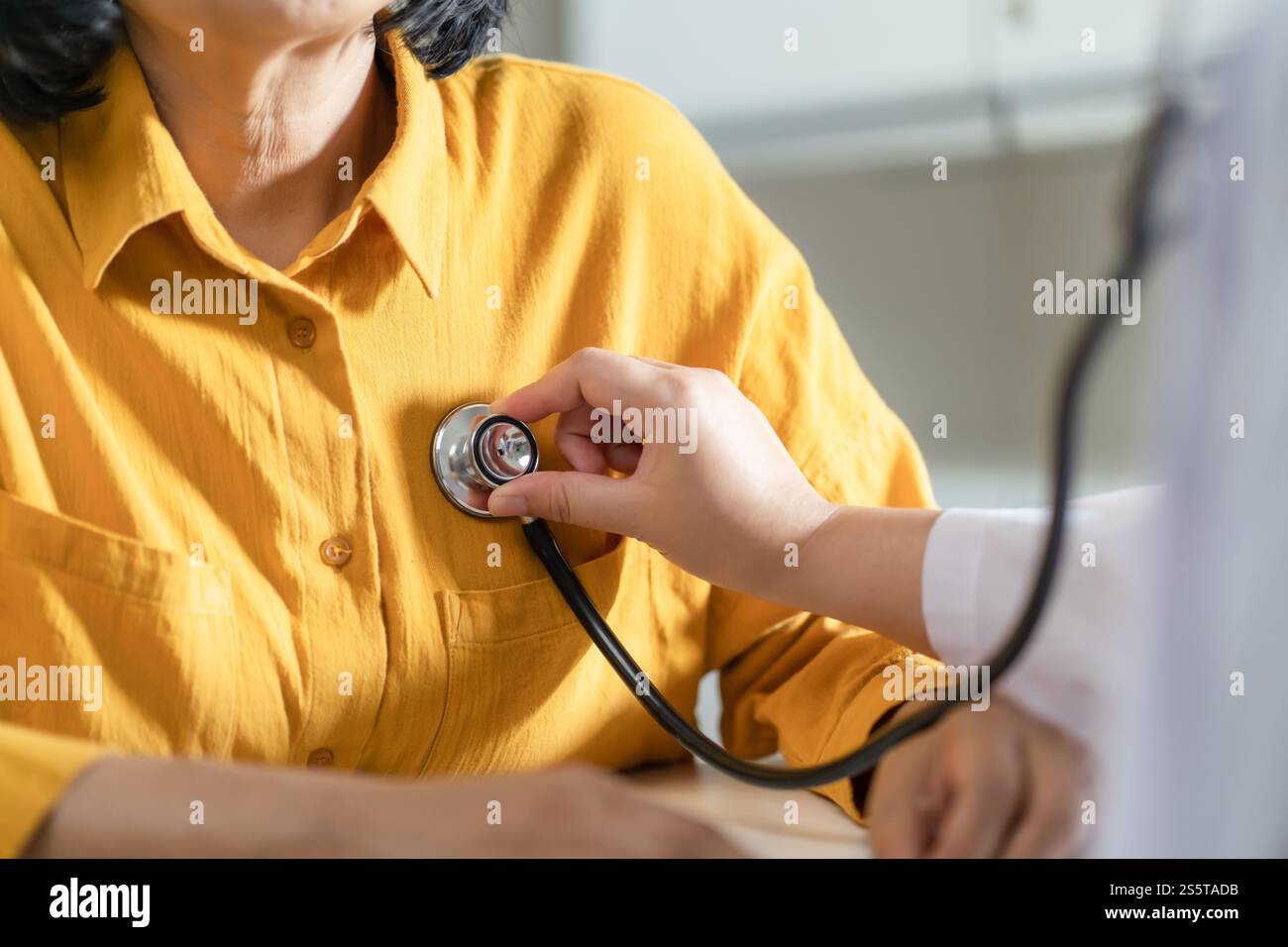 Doctor using a stethoscope checking patient stethoscope putting beat ...