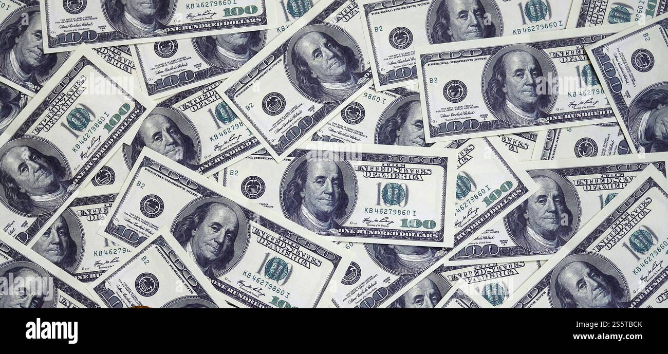 A pile of one hundred US banknotes with president portraits. Cash of ...