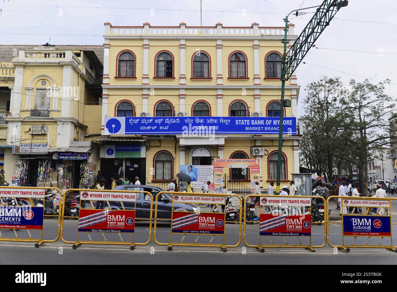 Mysore, Karnataka, South India, India, Building with bench on a busy ...