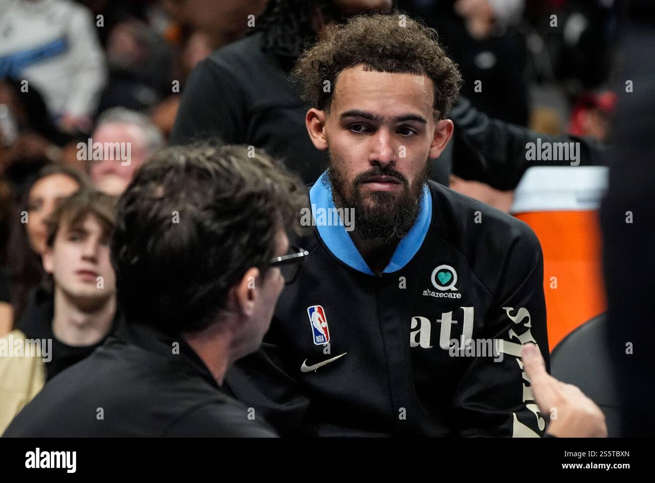 Atlanta Hawks guard Trae Young speaks with Atlanta Hawks head coach ...
