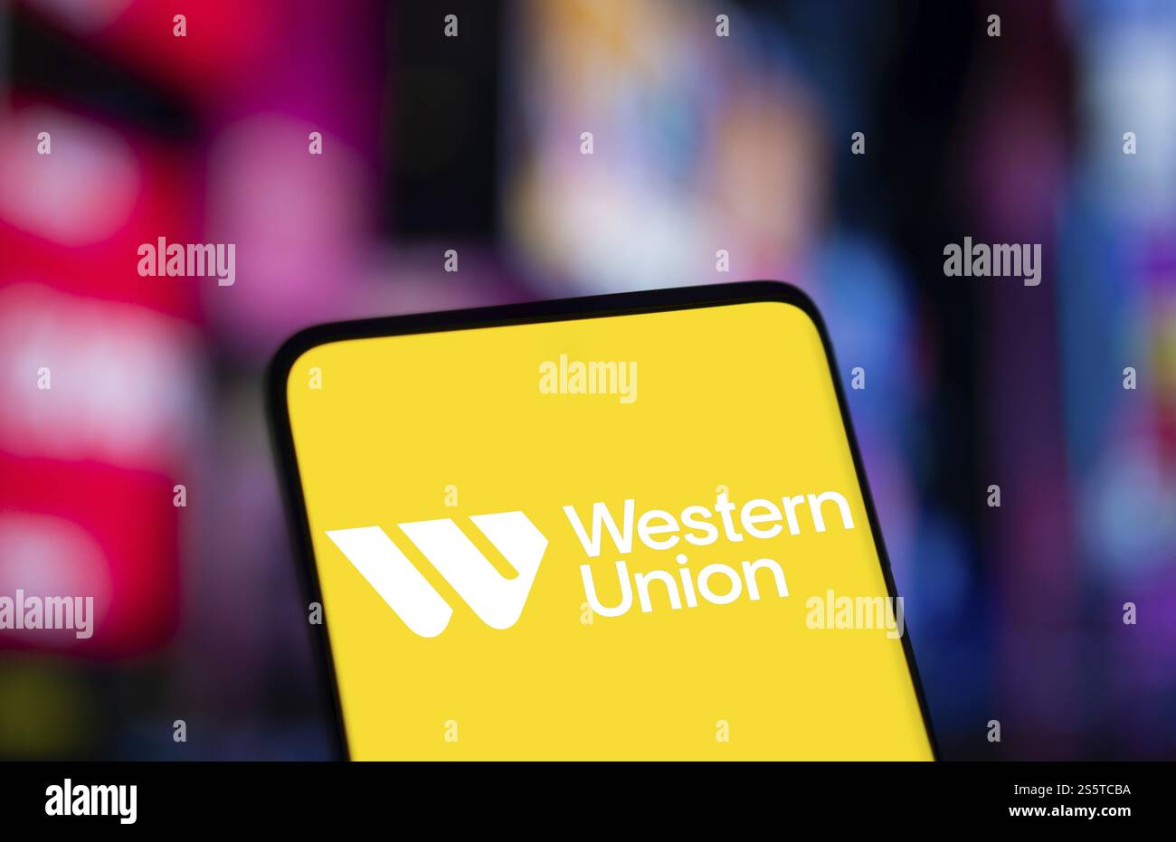 Western union logo is displayed on smartphone. The Western Union ...