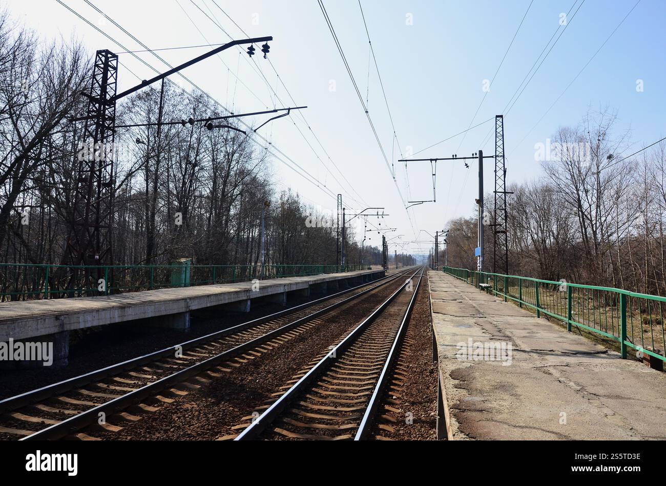 A railway station with platforms for waiting for trains in an urban ...