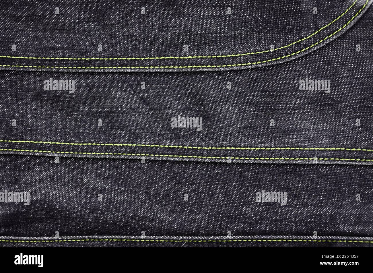 The texture of classic black denim cloth. Dark jeans background with ...
