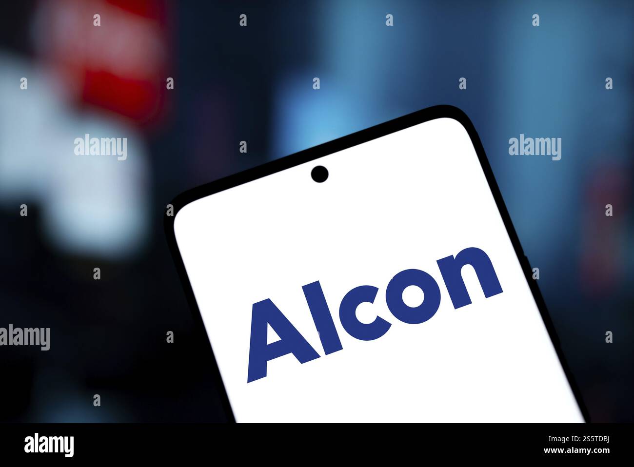 Alcon logo is displayed on smartphone. Alcon Inc. is a Swiss-American ...