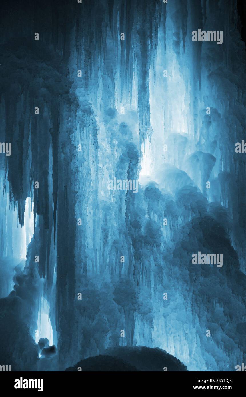 Huge ice icicles. Large blocks of ice frozen waterfall or water. Blue ...