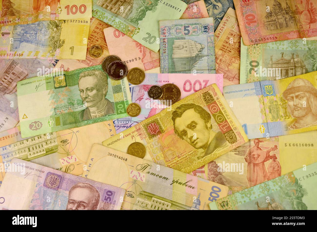 The background image of a pile of Ukrainian banknotes of different ...
