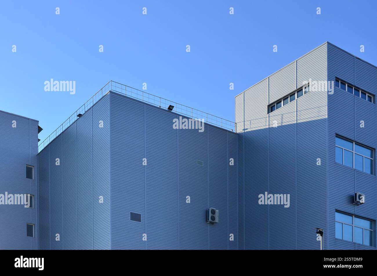 Photo of industrial high-rise building with perfect quality siding in ...