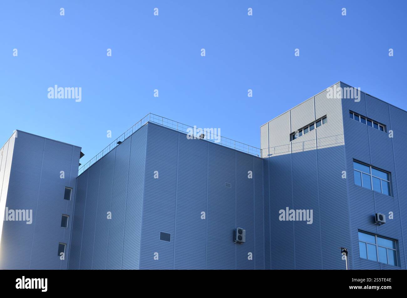 Photo of industrial high-rise building with perfect quality siding in ...