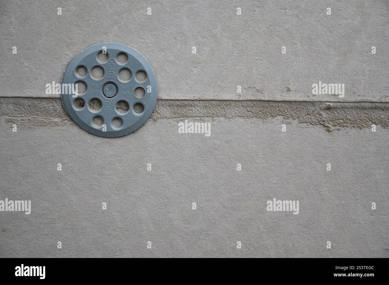 The texture of the wall, covered with gray foam polystyrene plates ...
