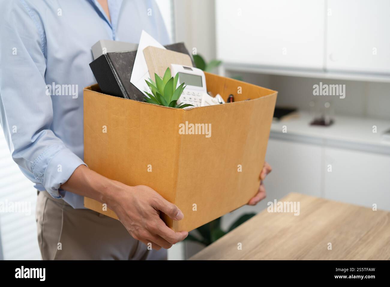 Business man sending resignation letter and packing Stuff Resign ...