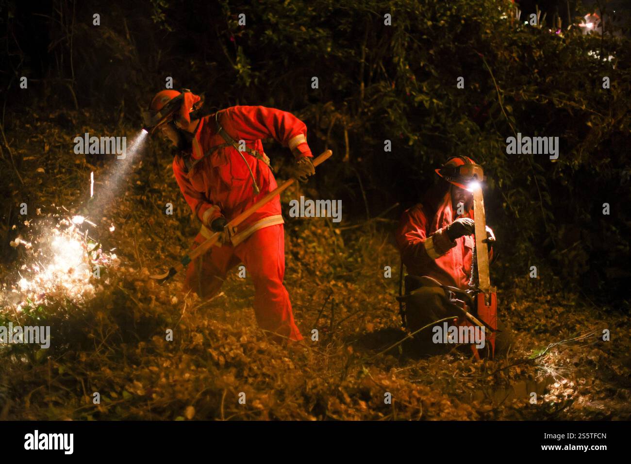 A California Department of Corrections hand crew works containment ...