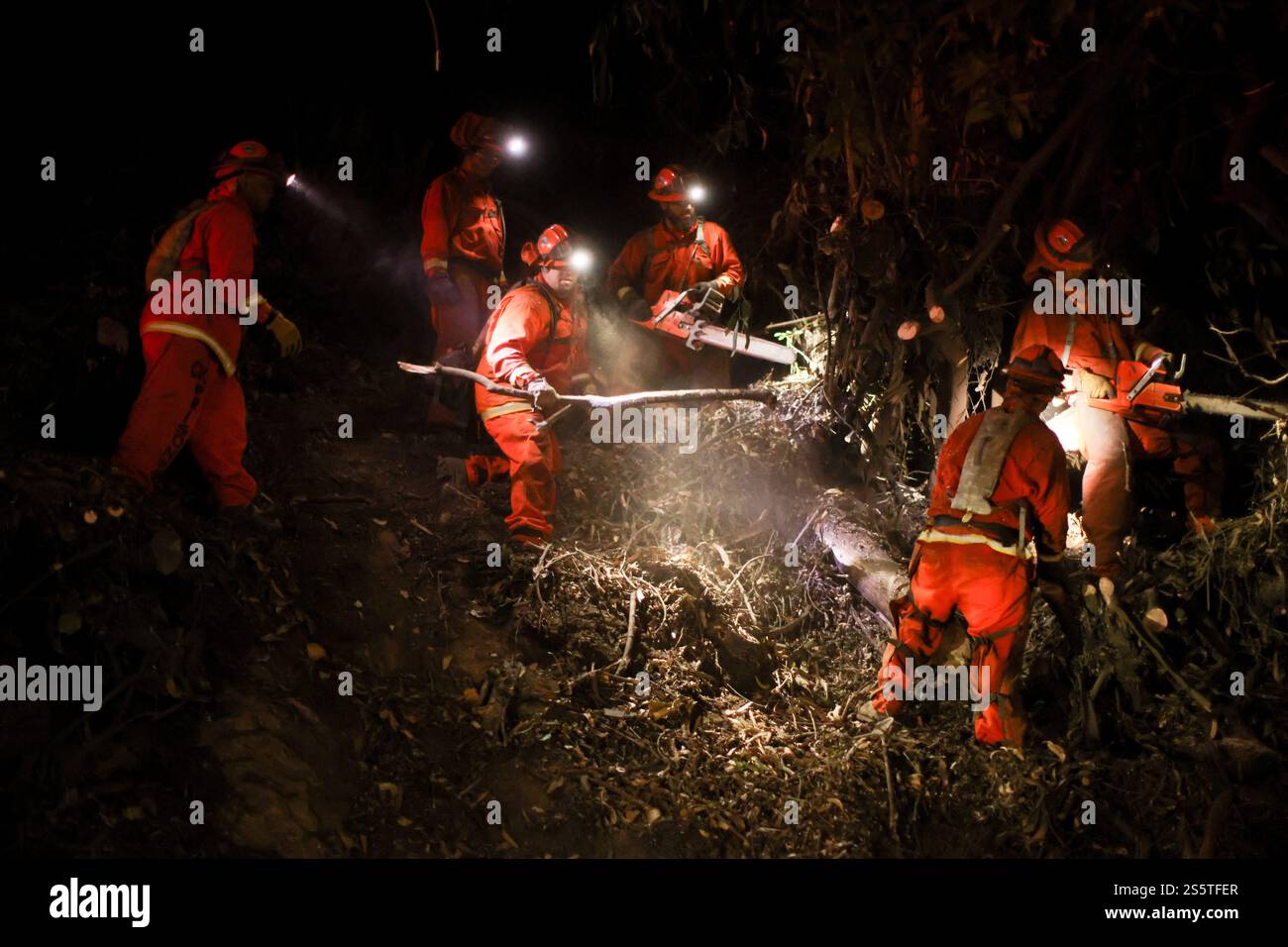 A California Department of Corrections hand crew works containment ...