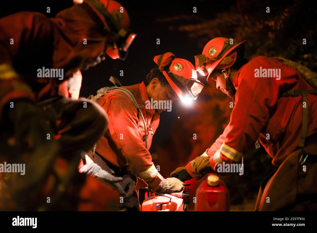 A California Department of Corrections hand crew works containment ...