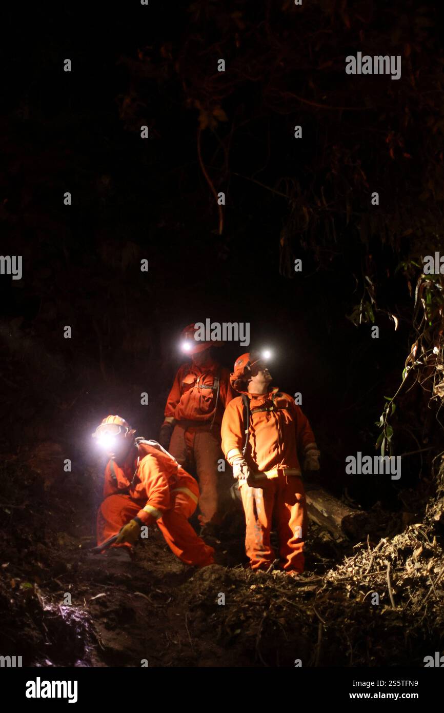 A California Department of Corrections hand crew works containment ...