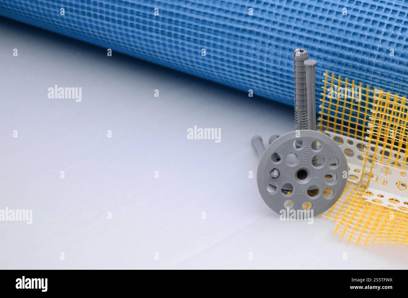 A set of construction items for the insulation of walls. Plastic dowels ...