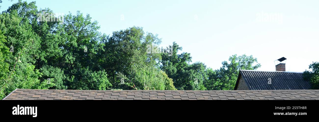 Modern roofing and decoration of chimneys. Flexible bitumen or slate ...