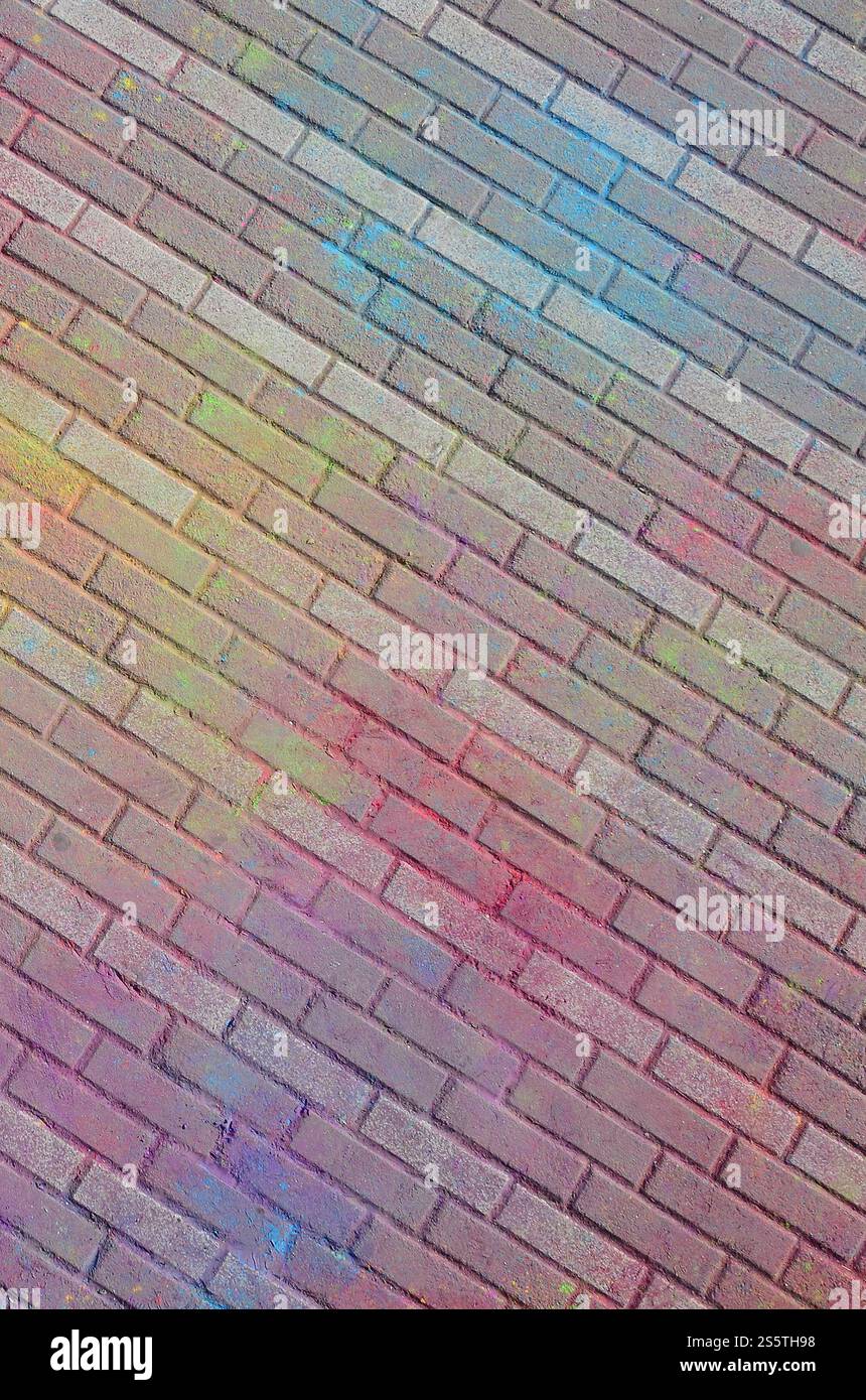 Multi colored earth, paving slabs, powder coated with dry colors at the Holi festival close up ...