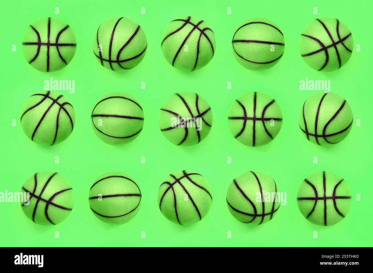 Many small green balls for basketball sport game lies on texture ...