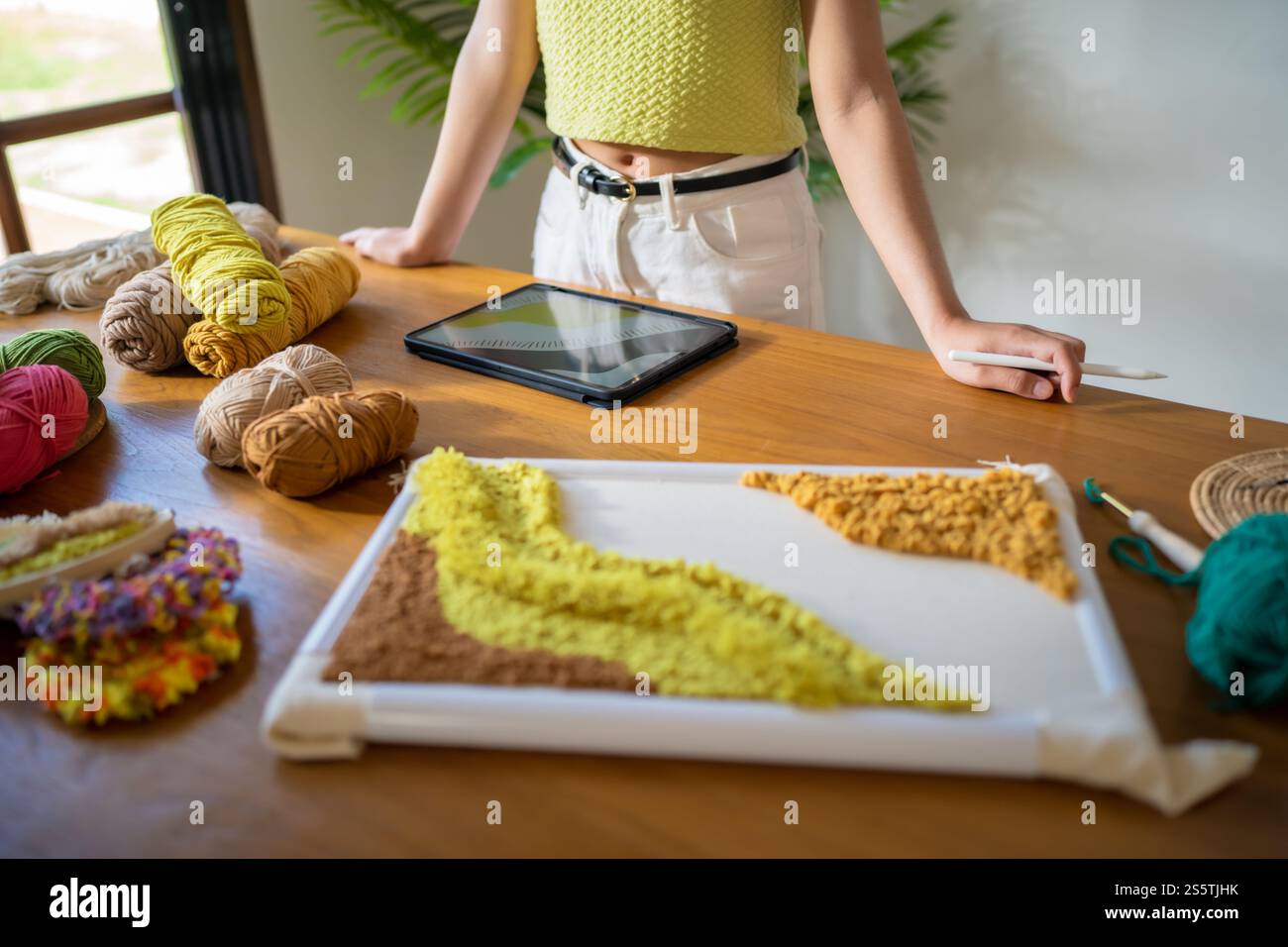 Designer Asian Woman holding digital tablet creative for handmade Punch ...